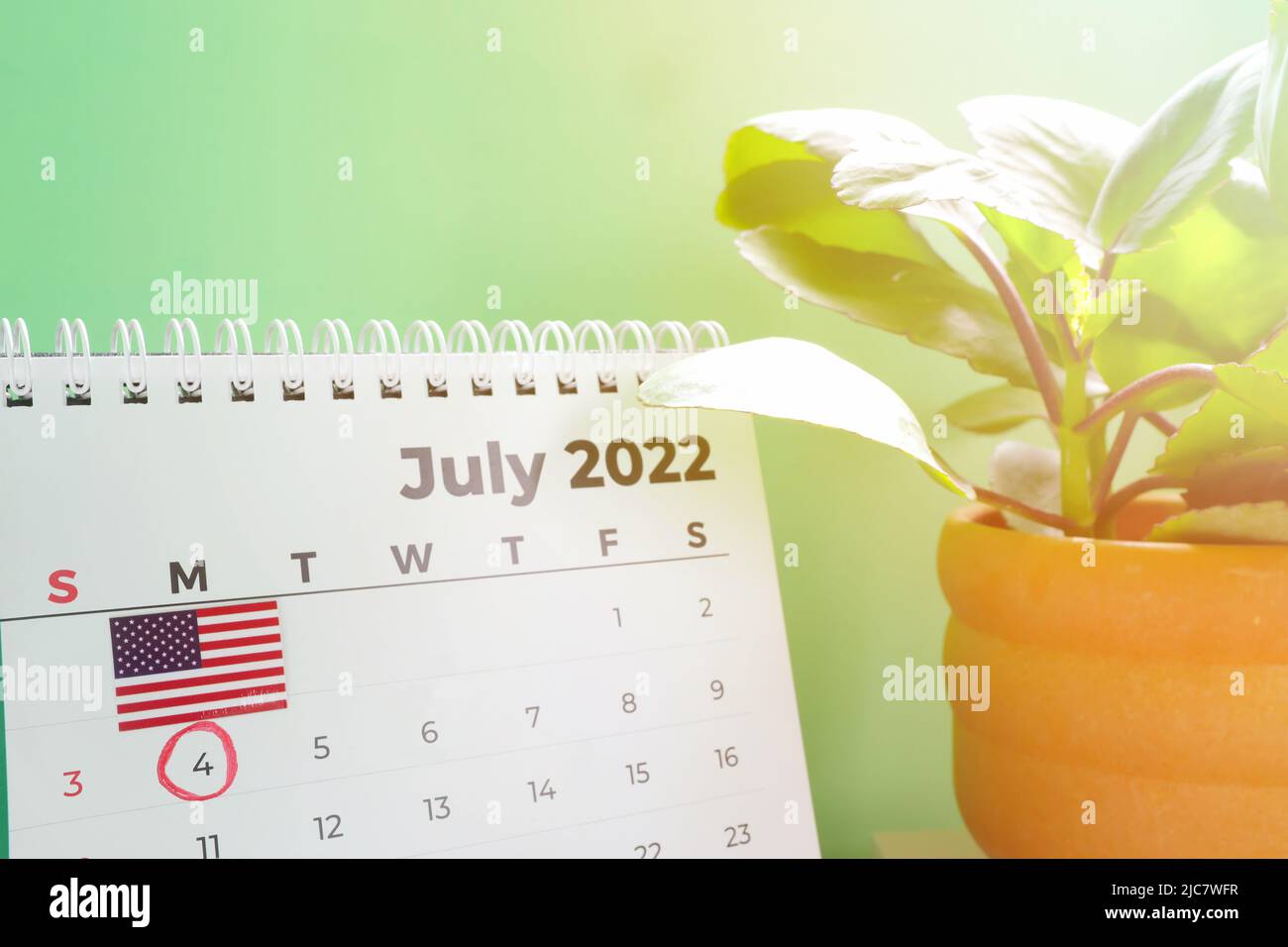 Selective focus of July 2022 desk calendar with marked date 4th of July ...