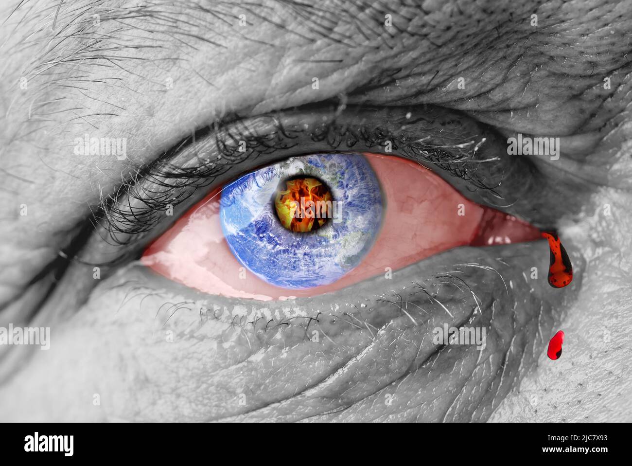 The earth globe inside of a man's eye. the concept of the destruction ...