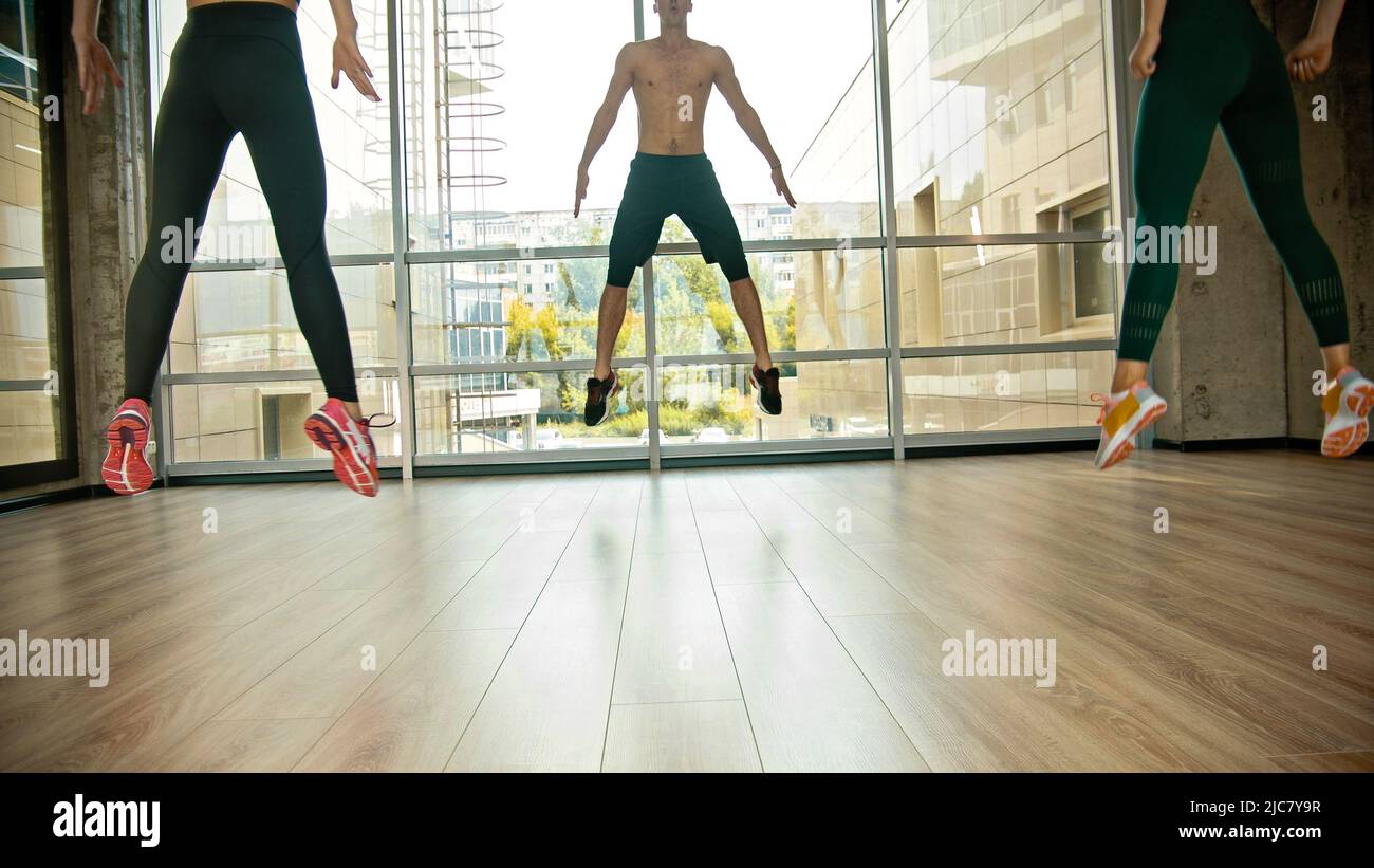 Crossfit training in the studio - two young women training with their ...
