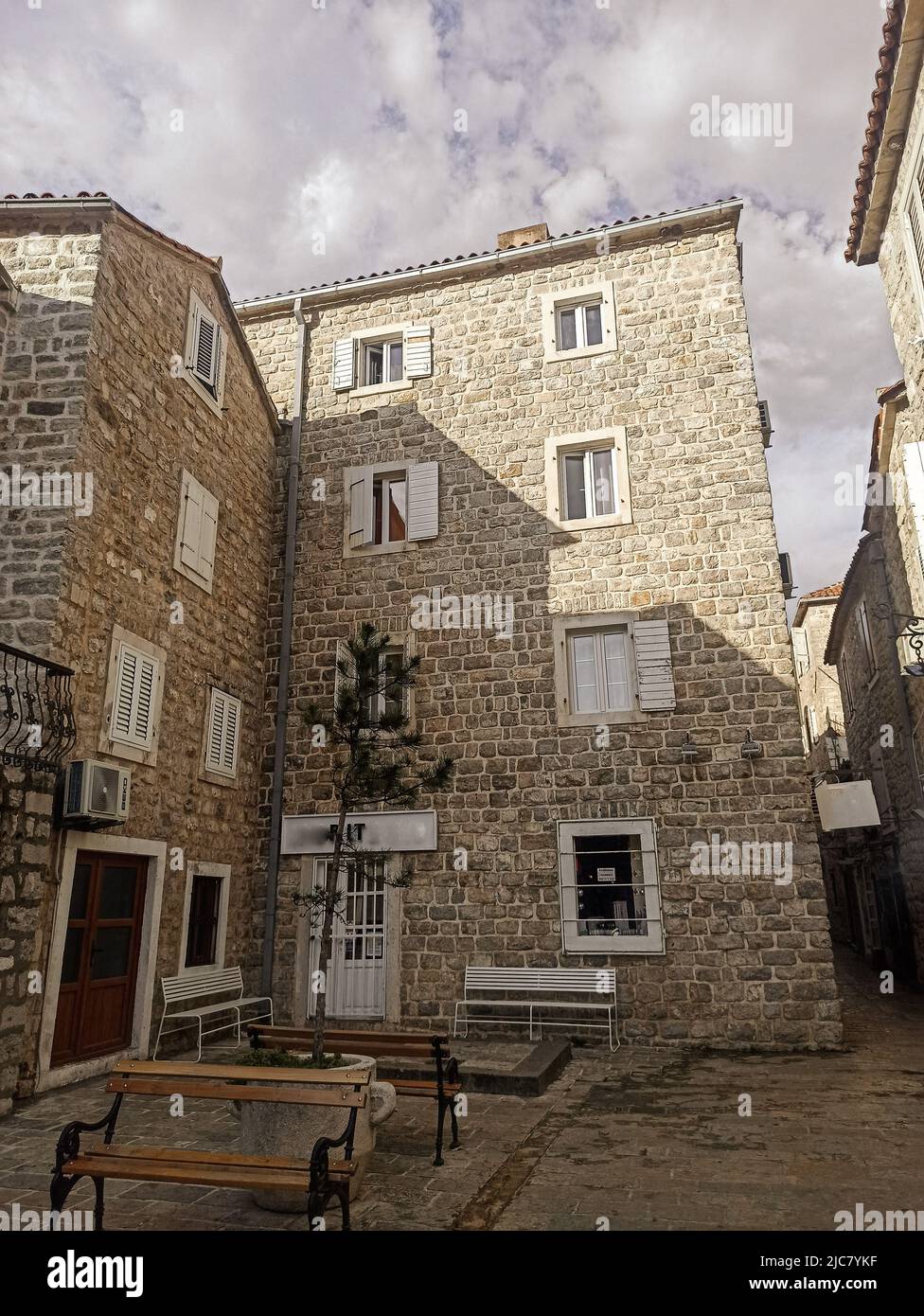 Beautiful stone square with narrow streets in the old town of Budva ...