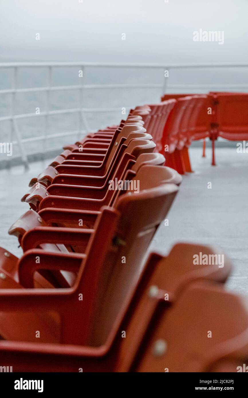 Deck chairs on ferry Stock Photo - Alamy