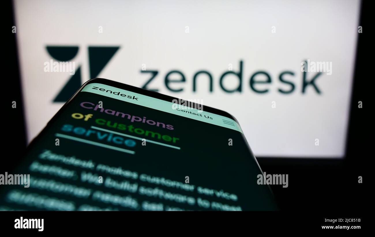 Mobile phone with website of US software company Zendesk Inc. on screen in front of business ...