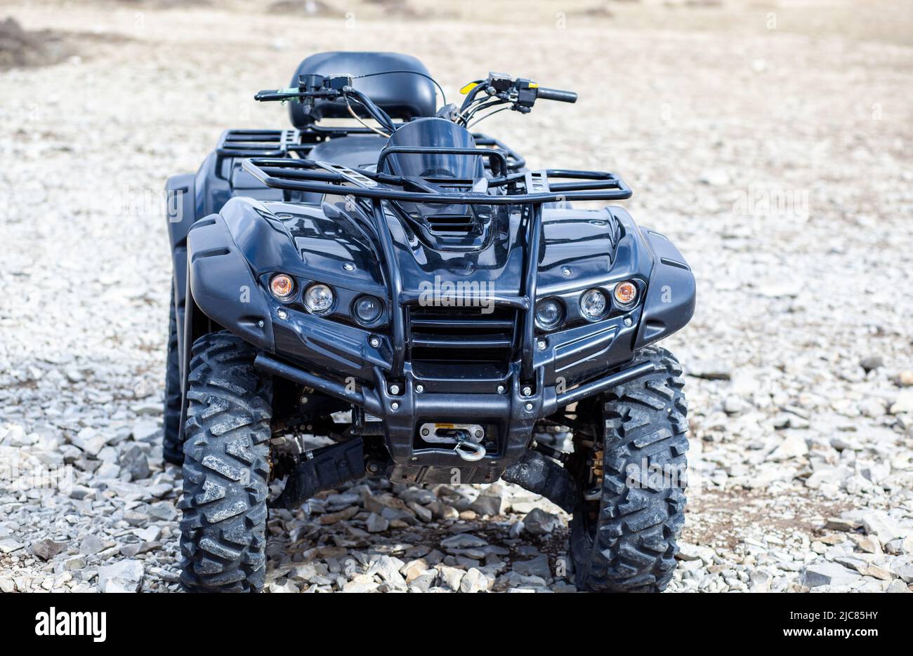 ATV Quad Bike in front of mountains landscape. Skiing and outdoor ...