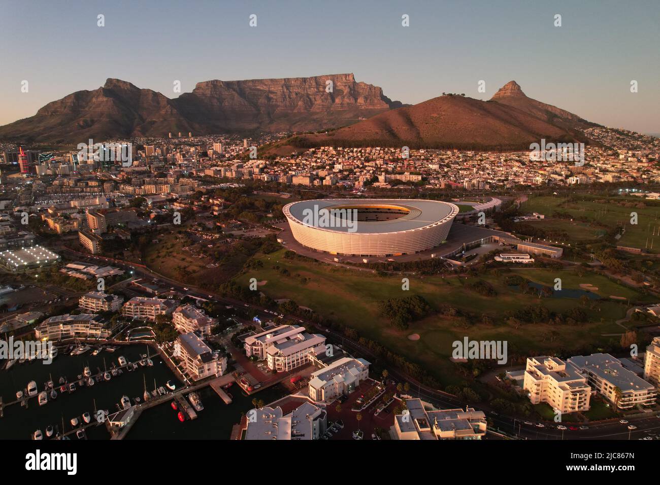 Cape Town Stadium, Table Mountain and Lions Head, sunset aerial drone ...