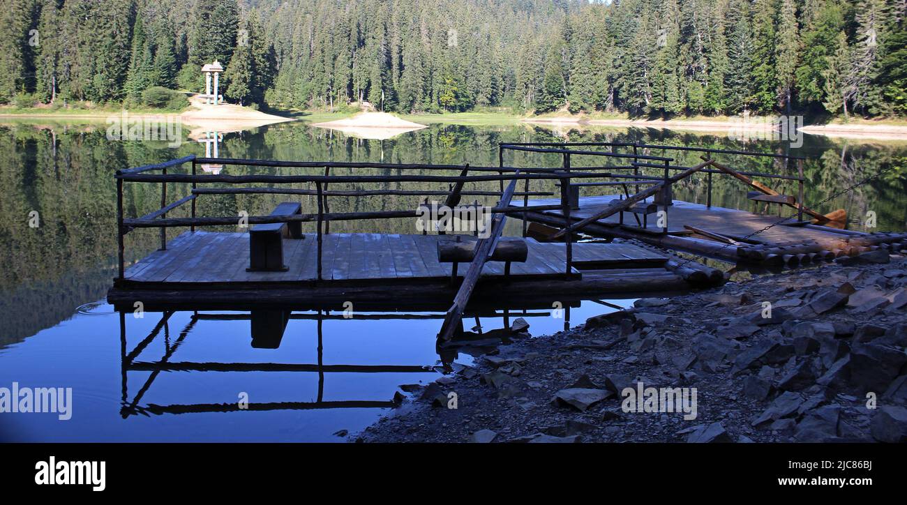 Vintage Wooden Rafts With Paddles Near Shore On A River Stock Photo - Alamy