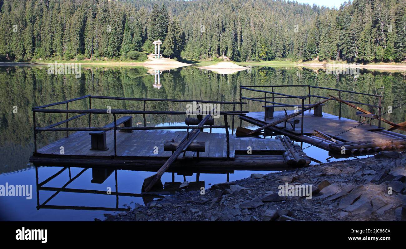 Wooden Rare Oar Rafts On A Shore Of Forest River Stock Photo - Alamy