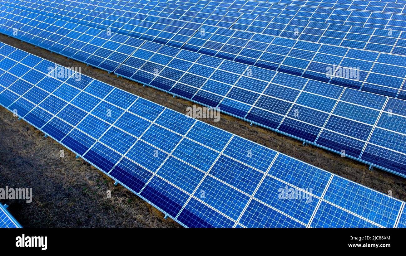 Aerial drone view flight over solar panels on sunny day close-up ...