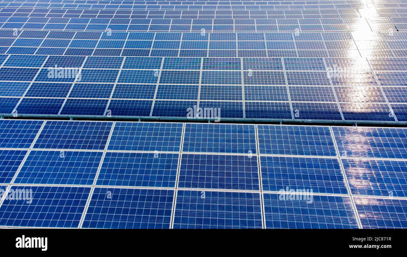 Aerial drone view flight over solar panels on sunny day close-up ...