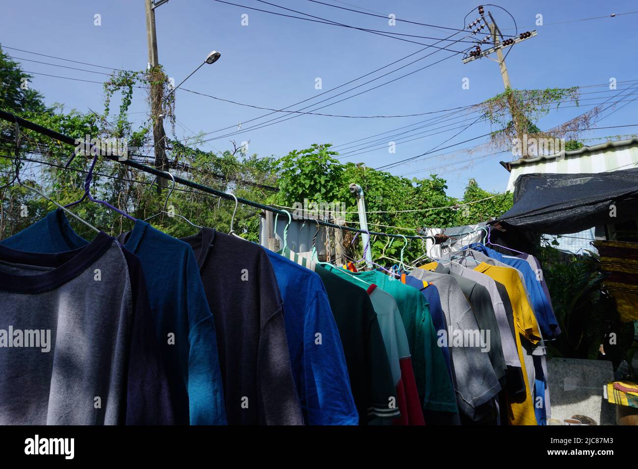 Hang clothes and pants to dry after washing Stock Photo - Alamy