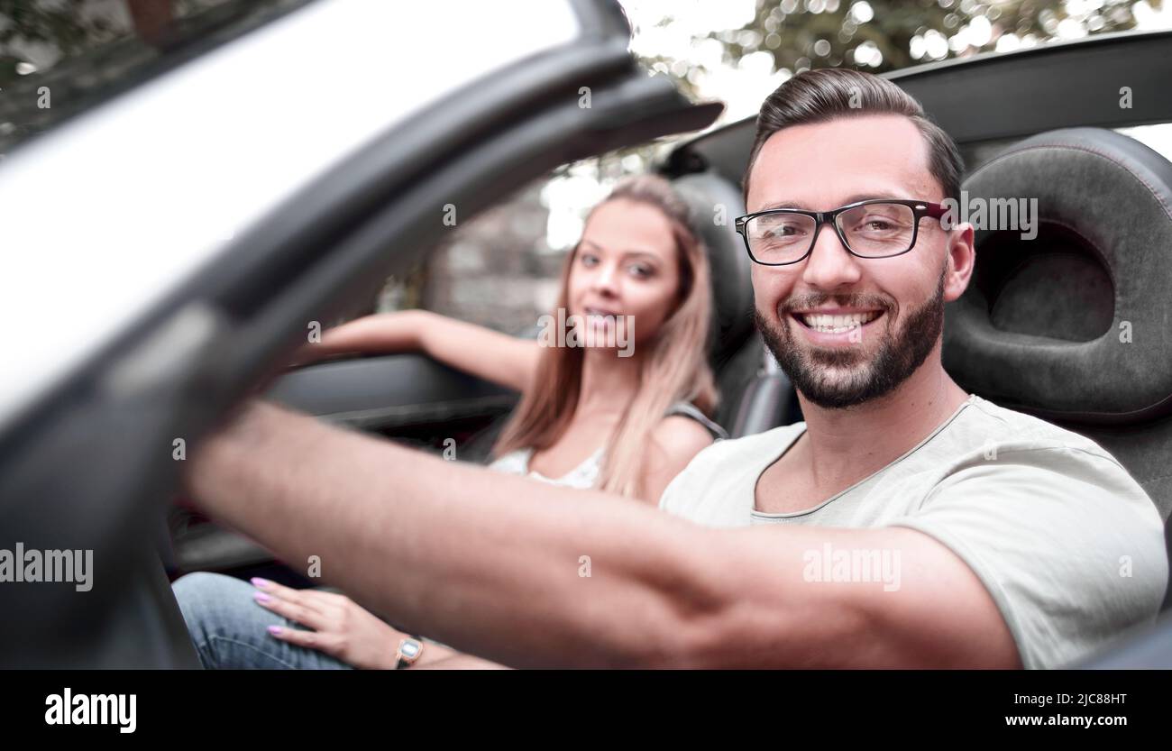 close up.young man driving a convertible car Stock Photo - Alamy