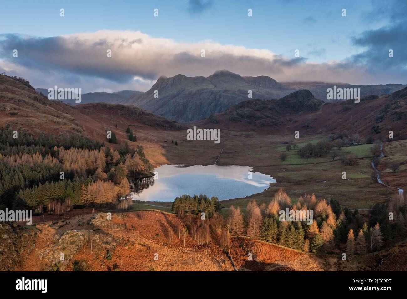 Epic aerial drone landscape image of sunrise from Blea Tarn in Lake ...