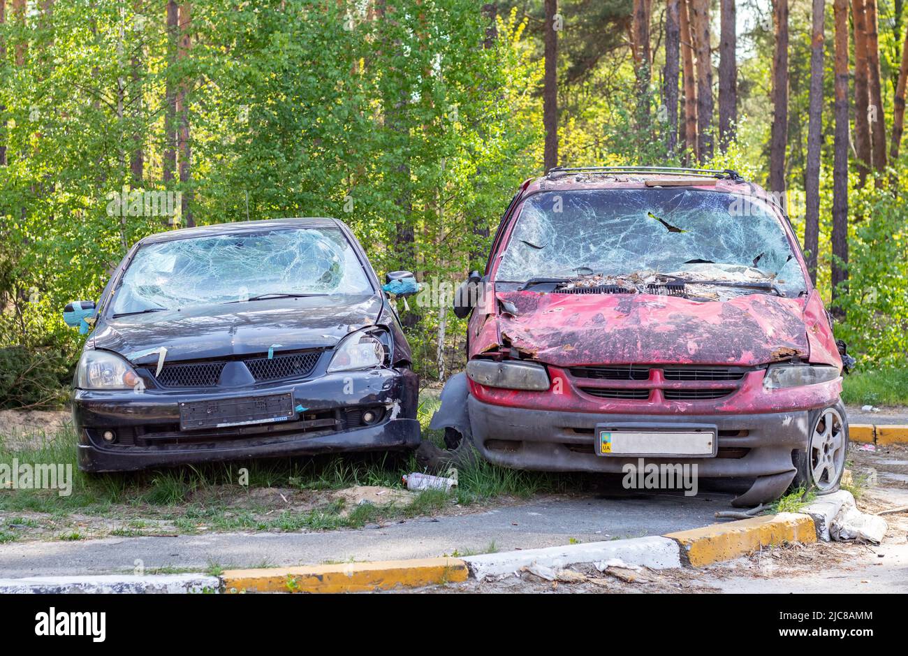 A car destroyed by shrapnel from a rocket that exploded nearby ...