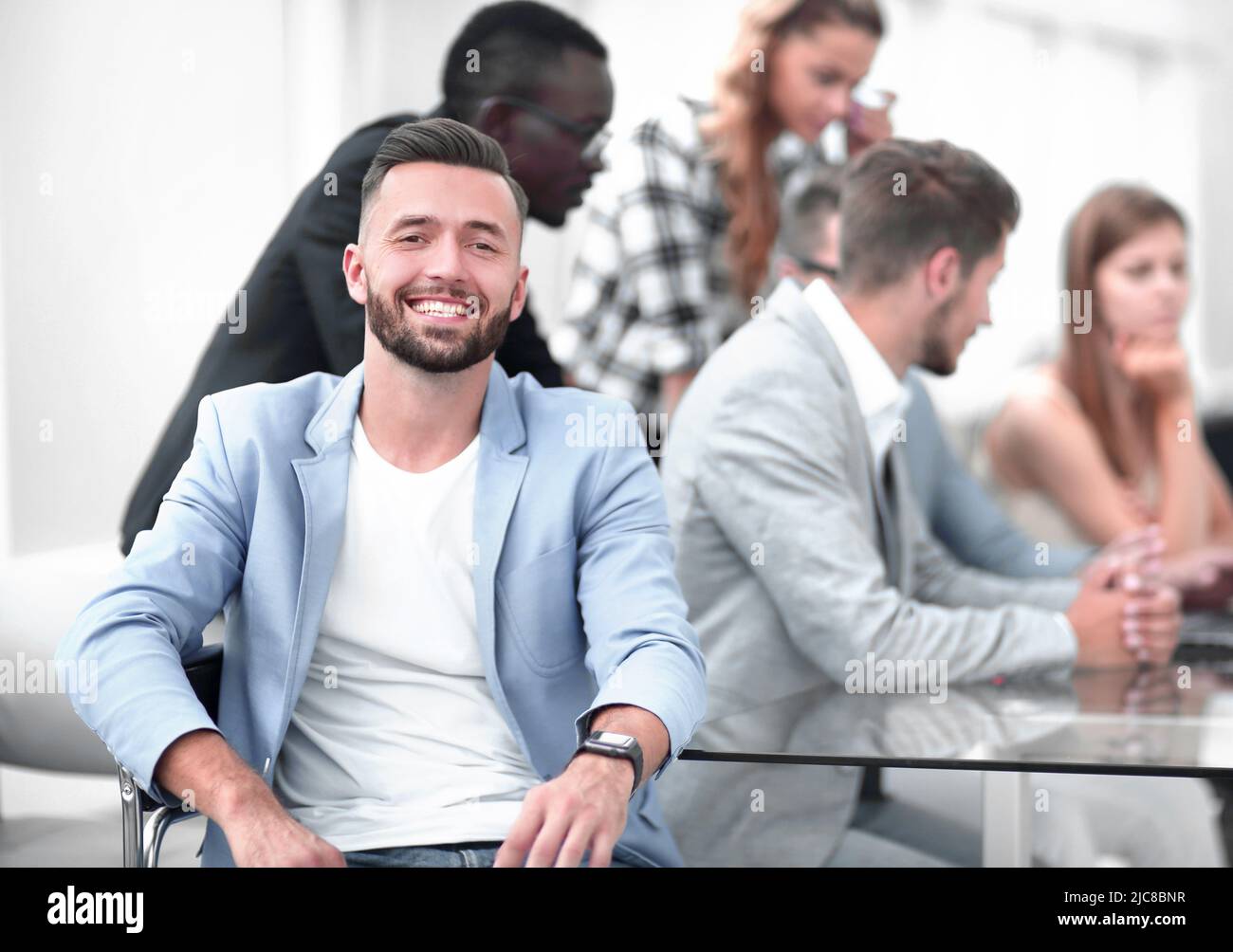 Group of fashion designers discussing designs in a studio Stock Photo ...