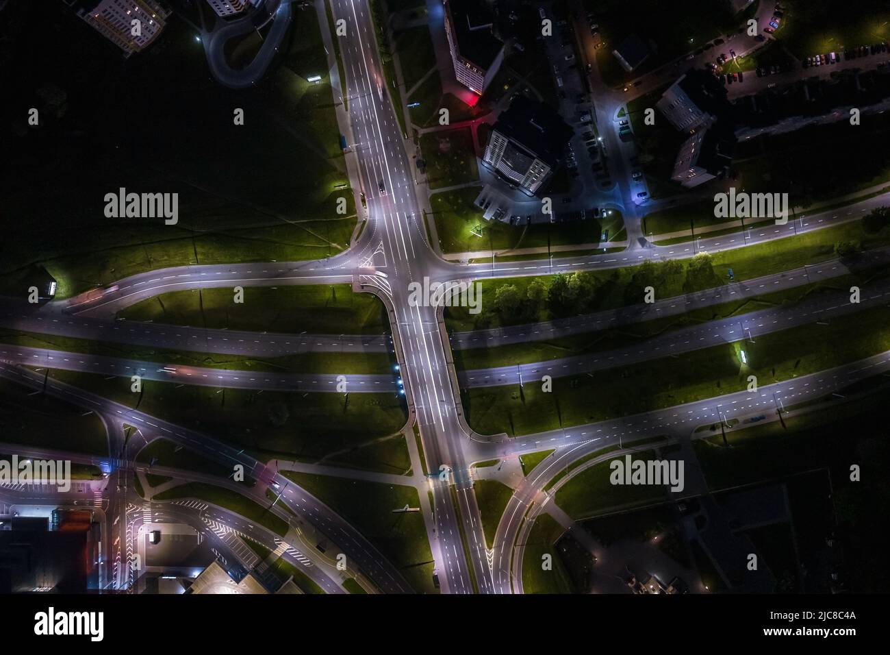 night over road junction, intersection road with cars with headlights ...