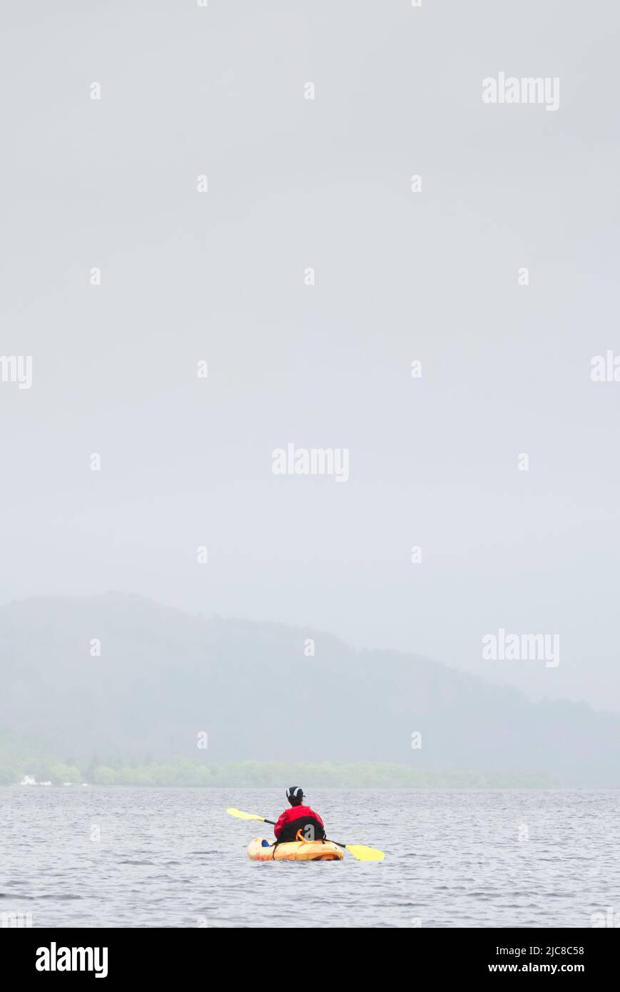 Yellow kayak on open water at Loch Lomond Stock Photo - Alamy