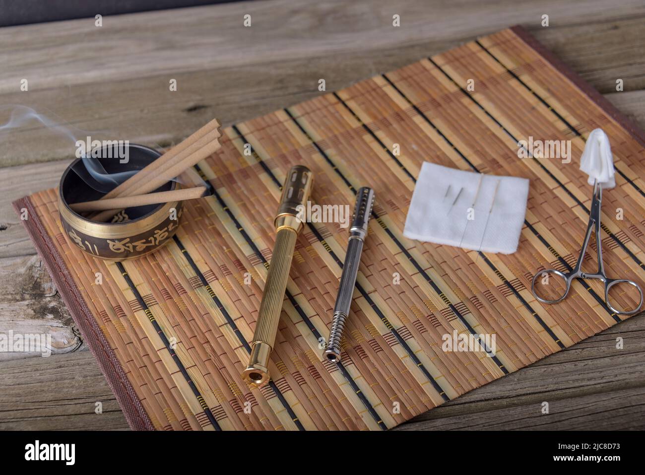 Chinese copper moxibustion box with smoke on bamboo Stock Photo - Alamy