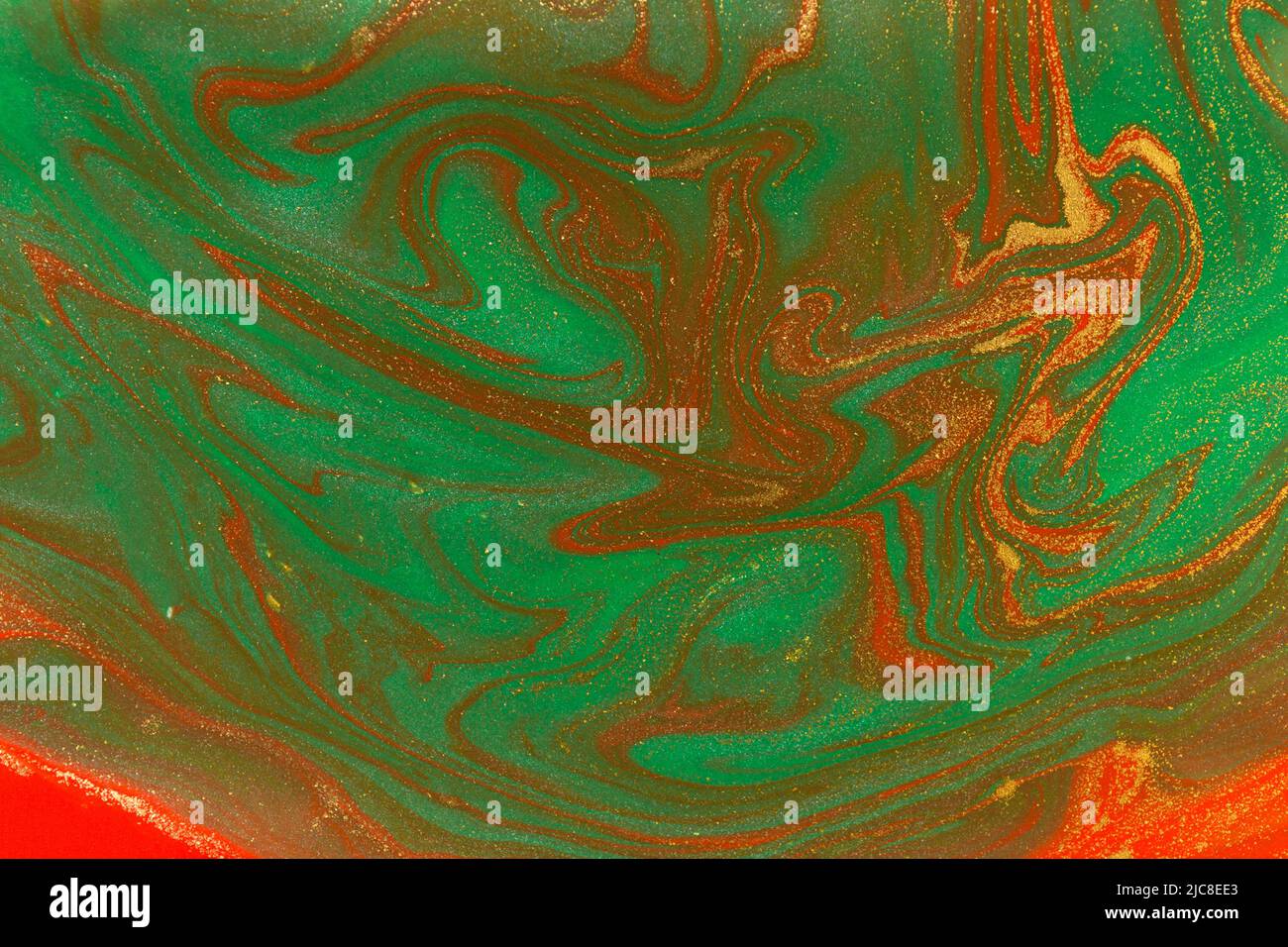 Gold waves on flow red and green paints abstract background Stock Photo ...
