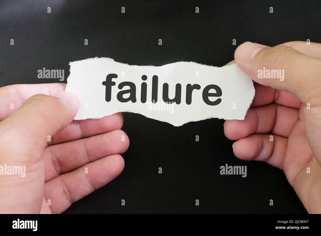 Handle and accept failure concept. Hand holding paper with written word ...