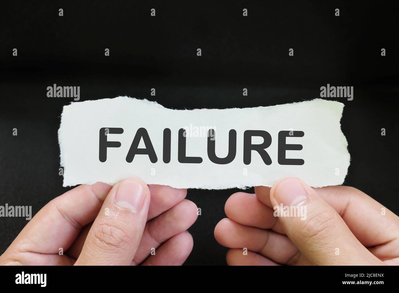 Handle and accept failure concept. Hand holding paper with written word ...