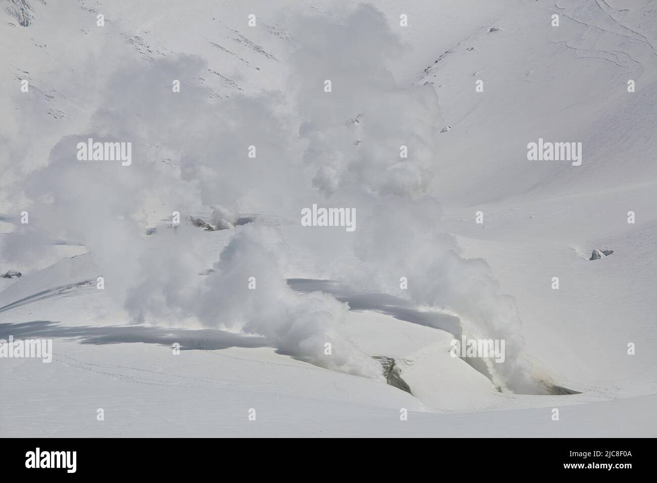 Steam rising from snowy active volcano landscape Stock Photo - Alamy