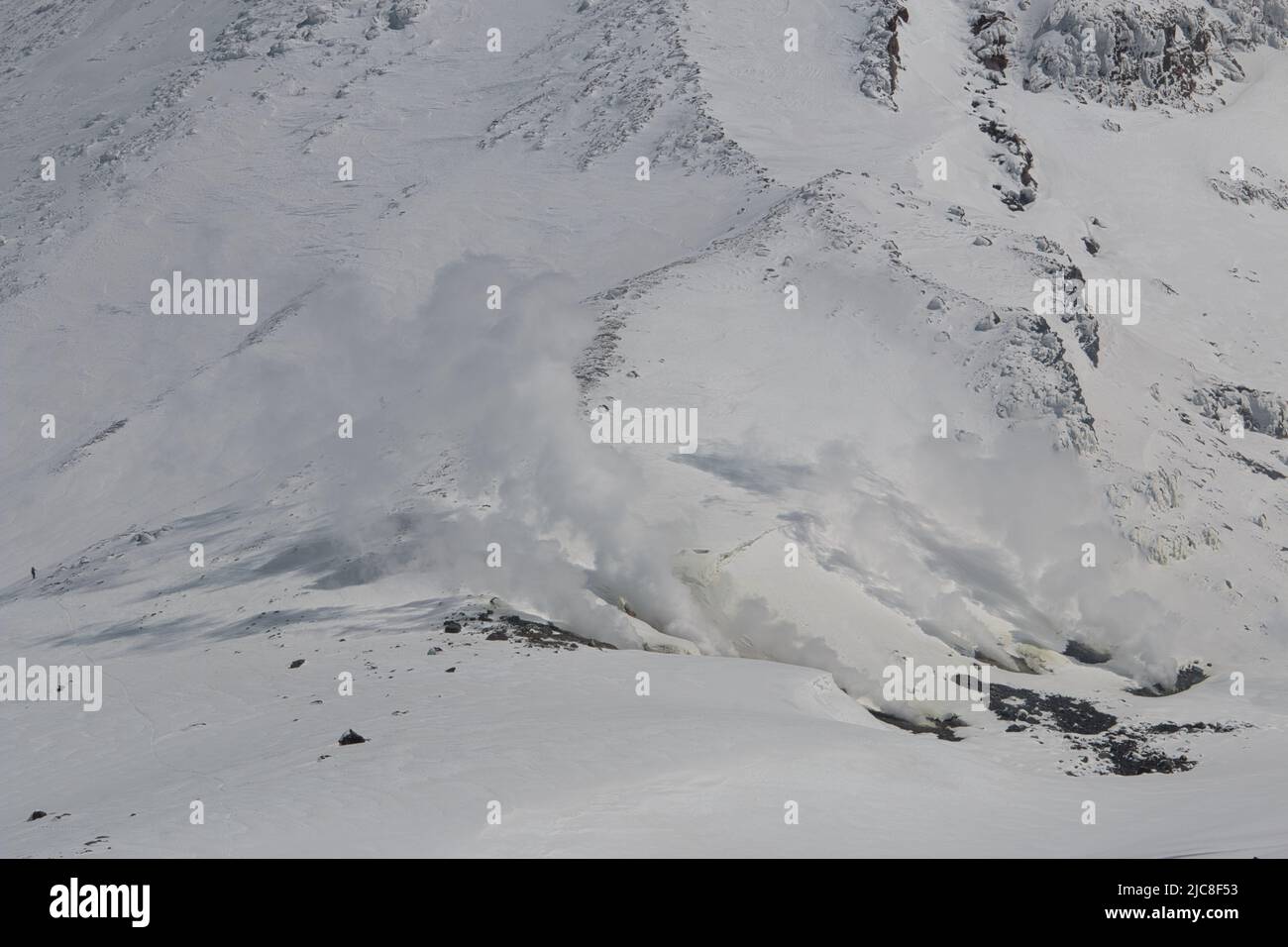 Steam rising from volcanic vents in a winter landscape Stock Photo - Alamy
