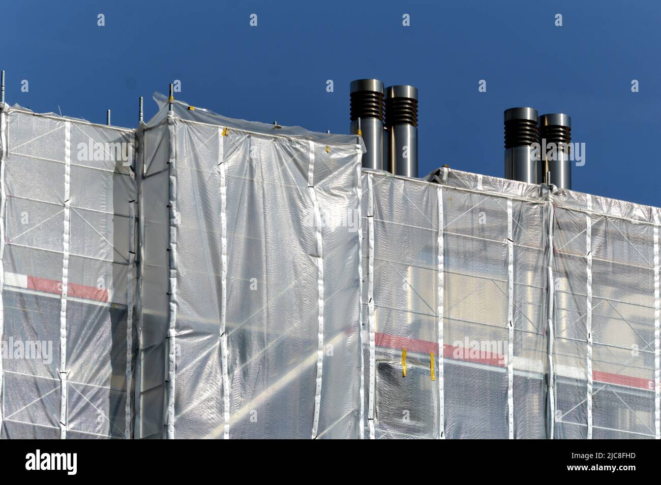 site with scaffolding and steel air vents Stock Photo - Alamy