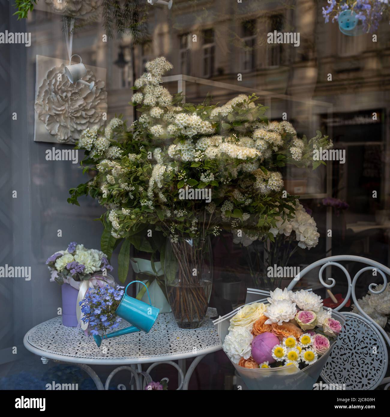bouquet of spirea in a vase in a flower shop window Stock Photo - Alamy