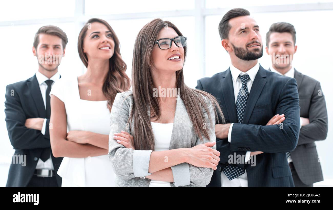 business team standing together and looking at copy space. the concept ...