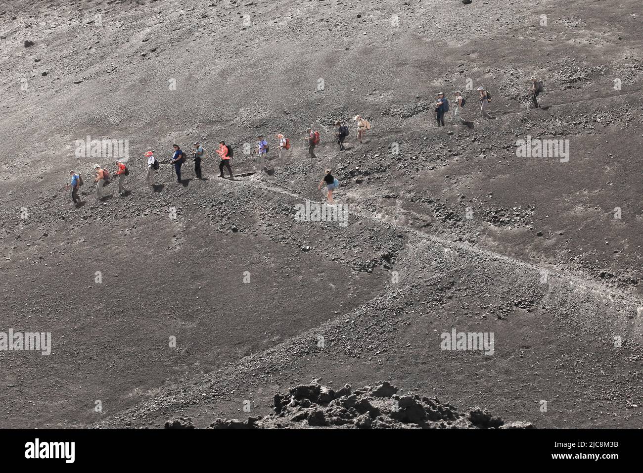 Trekking of hikers and tourists who walk to the Etna volcano crater ...