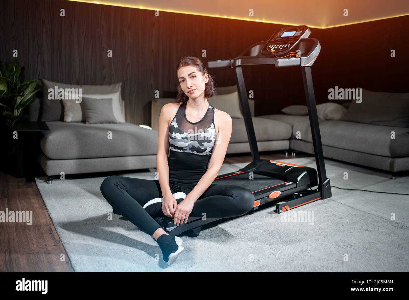 female feet running on treadmill in sport shoes, close up Stock Photo ...