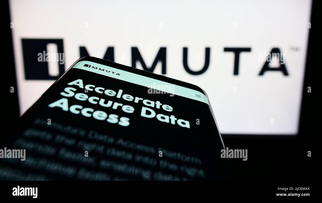 Smartphone with website of US software company Immuta Inc. on screen in ...