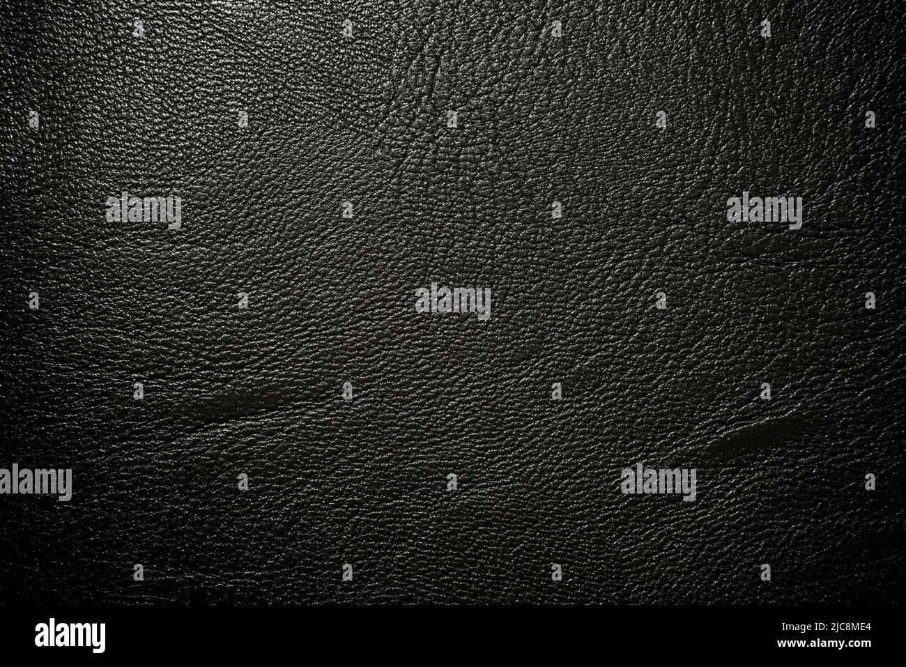 Black leather texture. Abstract background of dark leather with small ...