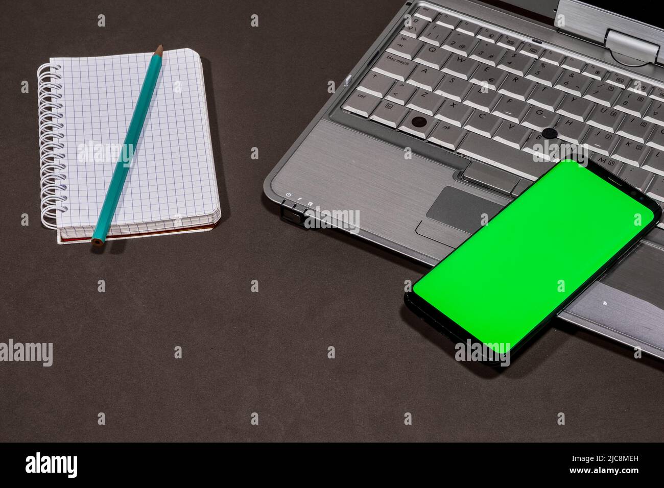 Composition, laptop, notebook and a mobile with a green screen Stock ...
