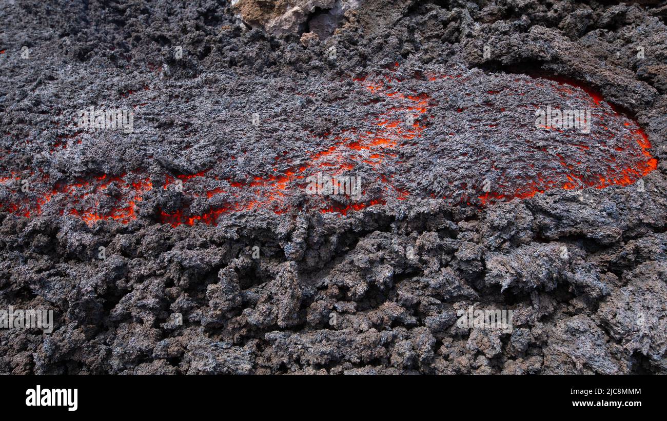 Incandescent lava flow on the Etna volcano in Sicily in the Valle del ...