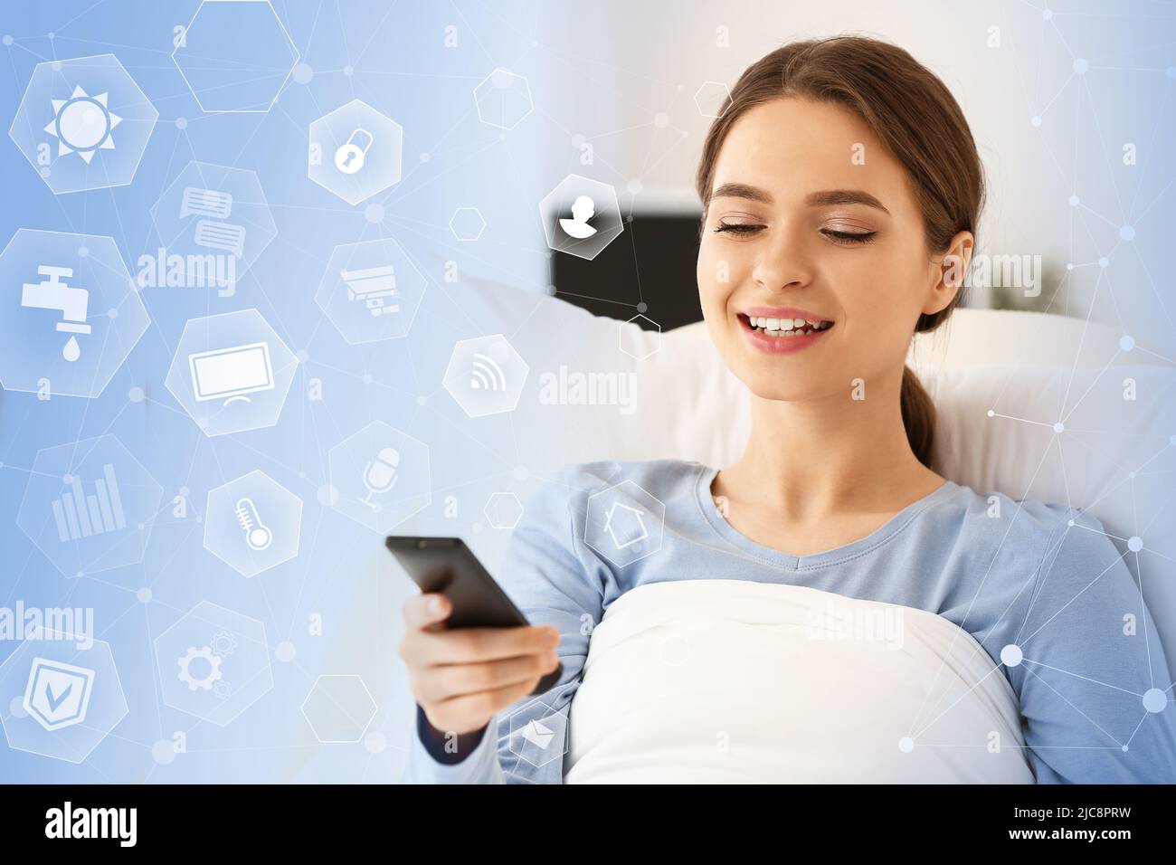 Woman using application of smart home automation in room Stock Photo ...