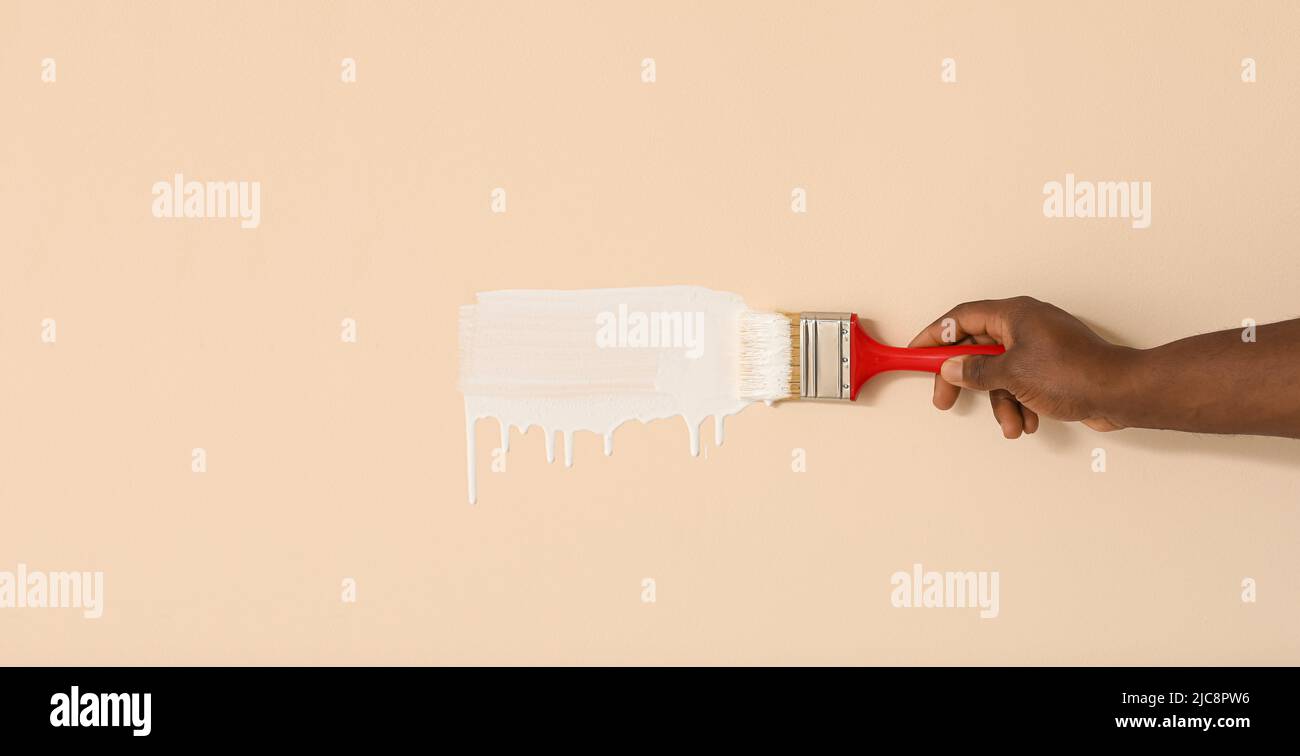 African american man painting wall hi-res stock photography and images ...