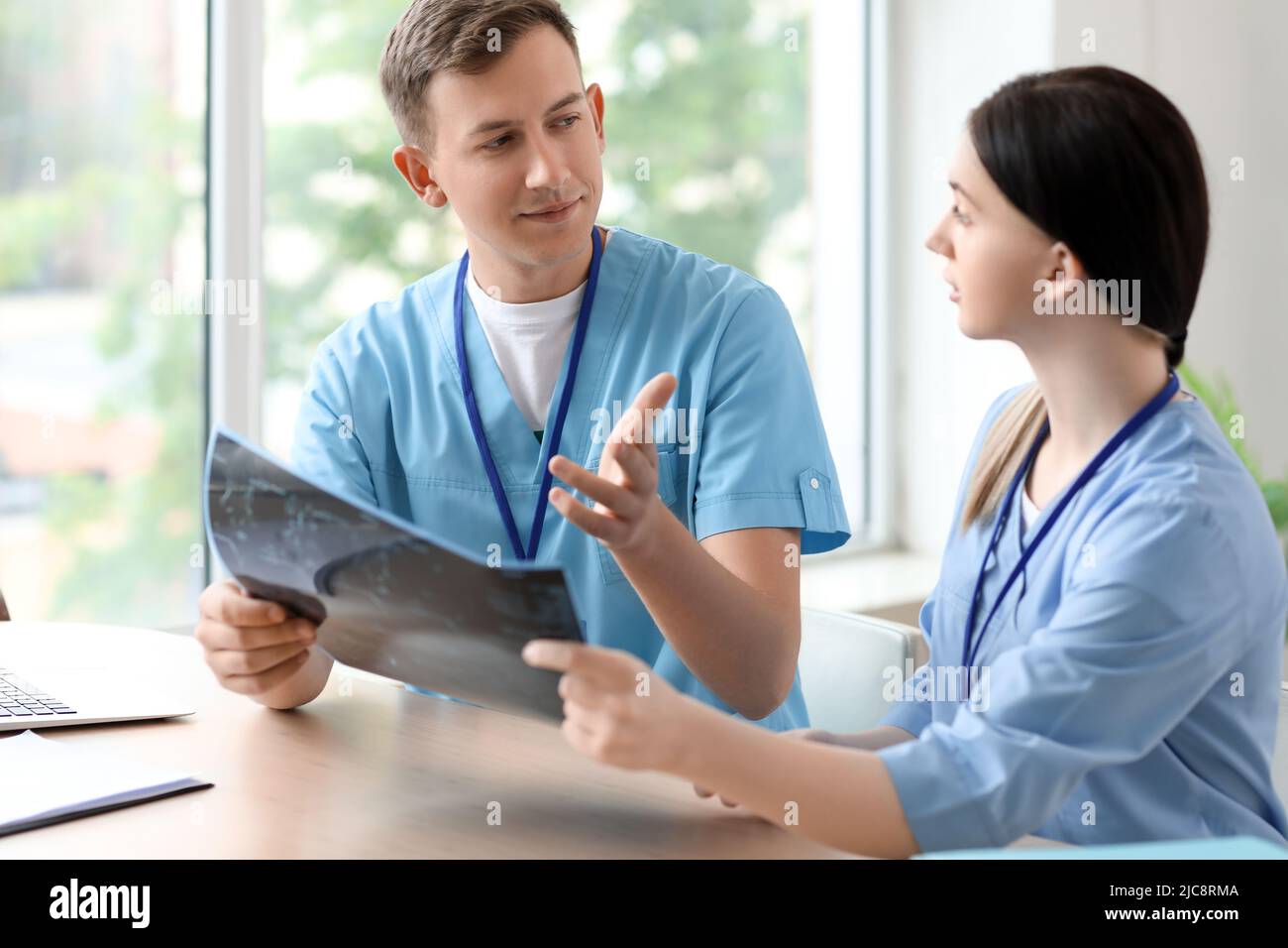 Medical assistants working with x-ray scan at hospital Stock Photo - Alamy