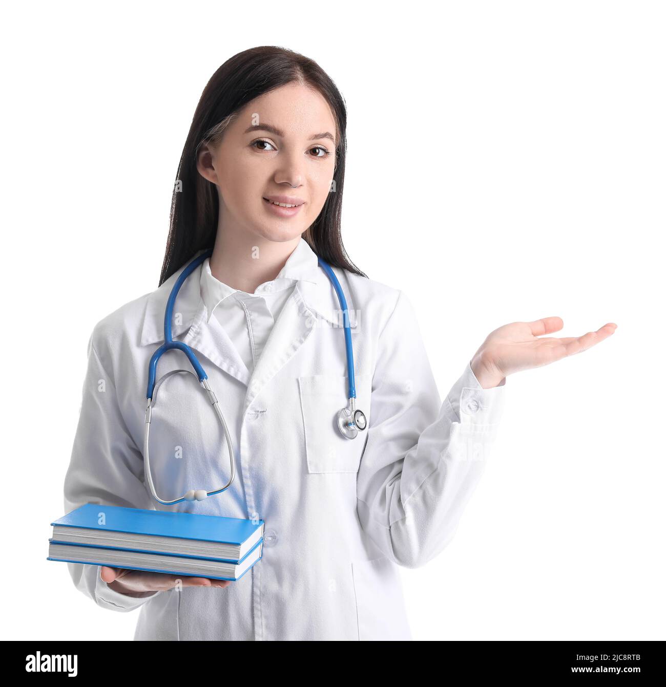 Female medical assistant with books showing something on white ...
