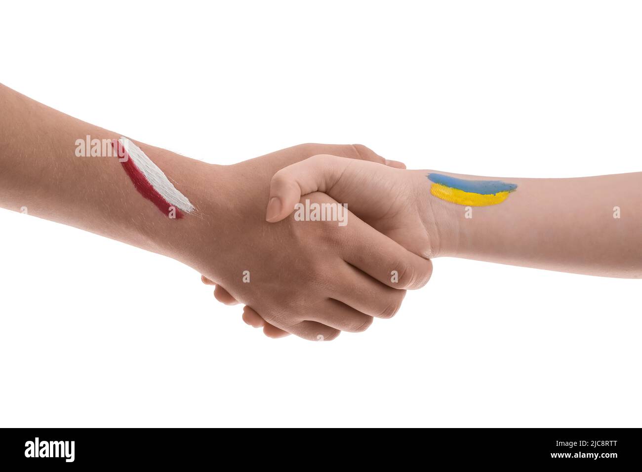 Volunteers with drawn flags of Ukraine and Poland shaking hands on ...