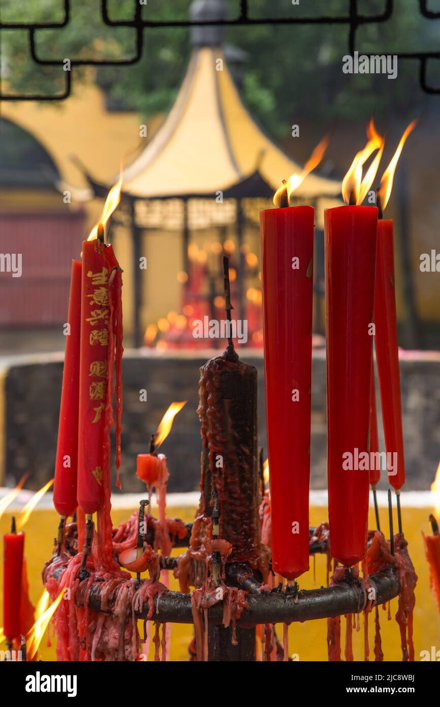 Votive candles with Chinese characters burning in the Arhat Hall of the ...