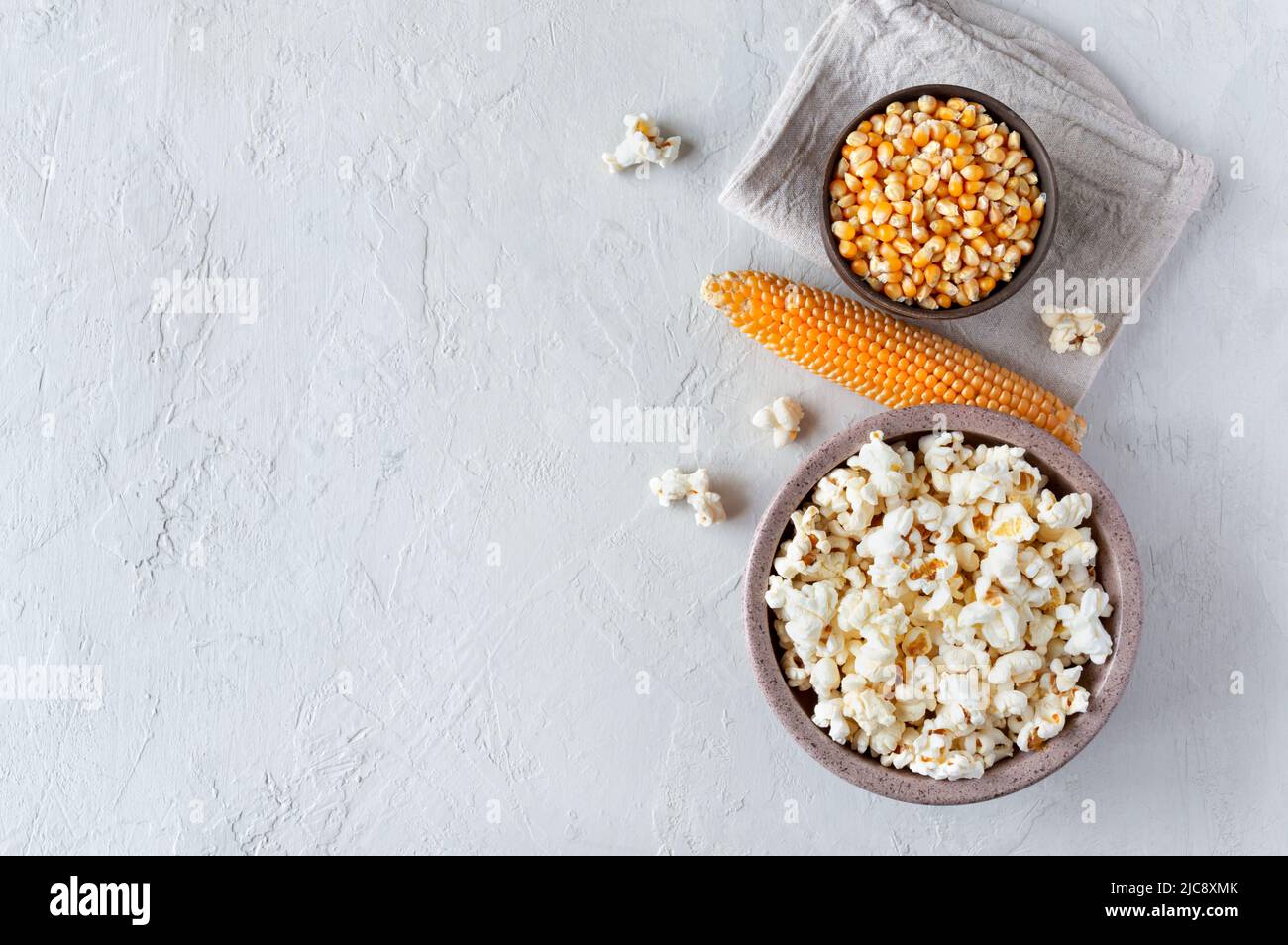 Homemade tasty traditional popcorn, raw corn seeds and corncob on ...
