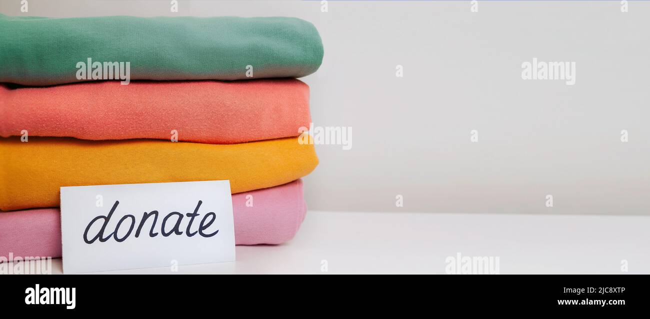 A stack of clothes. Clothes Donation, Renewable Concept. Preparing ...