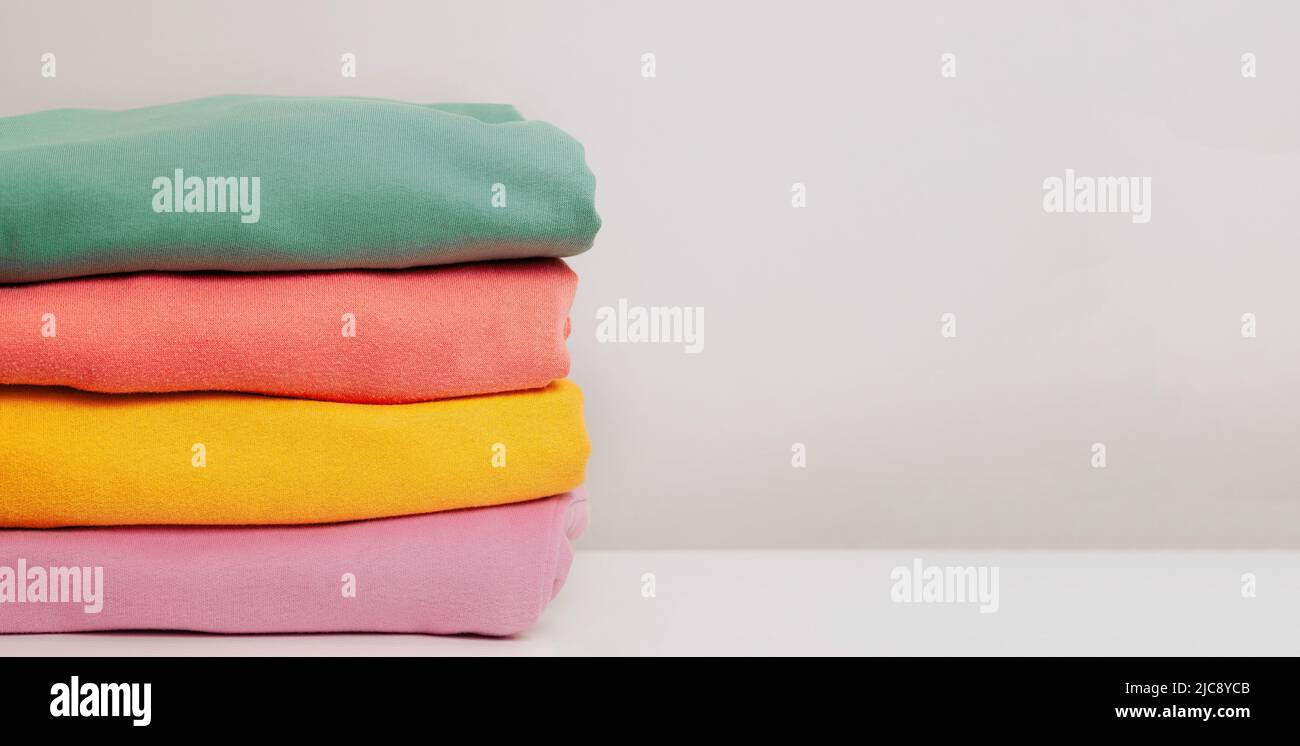 A stack of clothes. Clothes Donation, Renewable Concept. Preparing ...