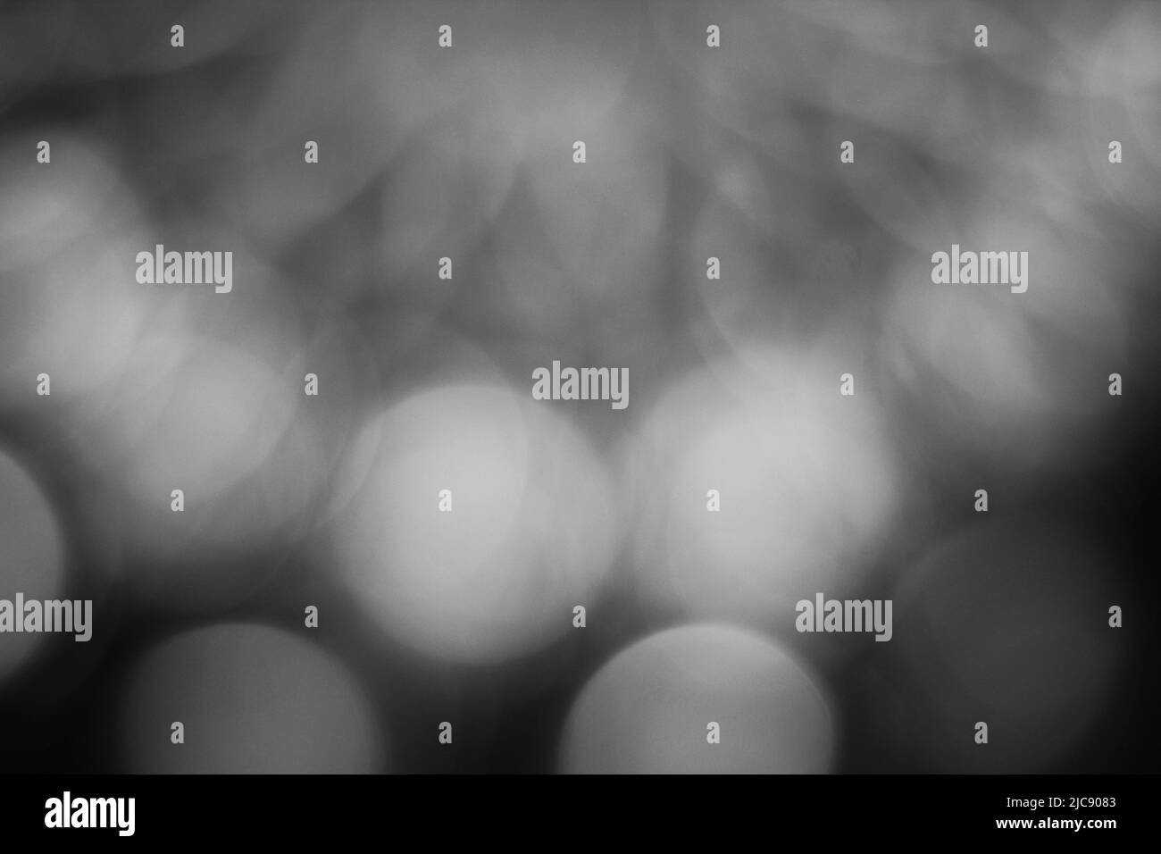 Beautiful blurry dreamy abstract view of a shiny pattern in balck and ...