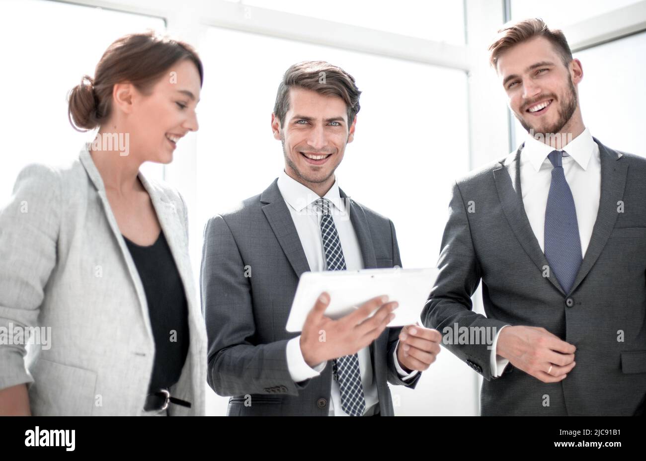 modern business team standing in the office Stock Photo - Alamy