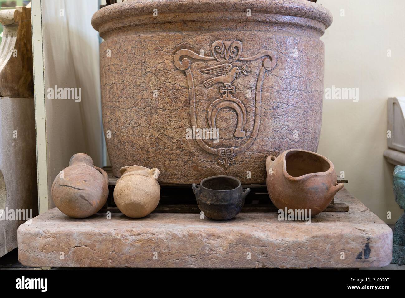Huge Terracotta Vase and Small Pots of the Same Material at its Bottom ...