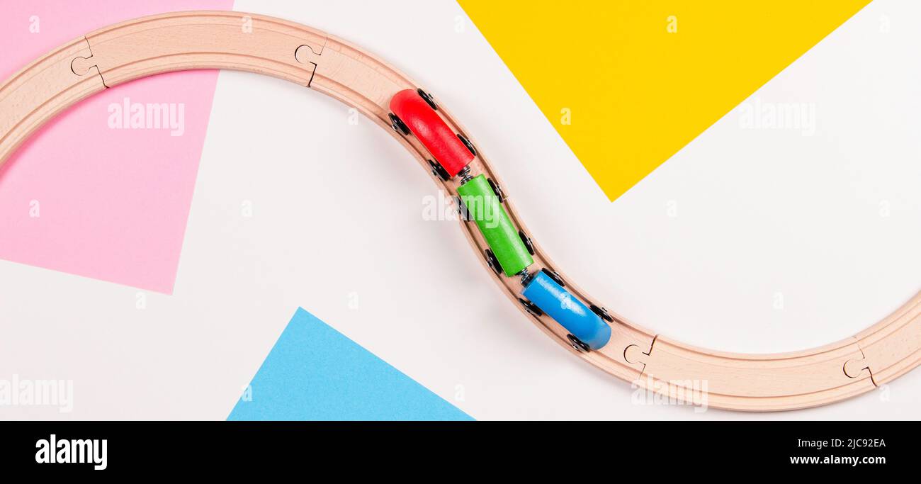 Kid toys background. Wooden toy train on curve wooden railways on ...