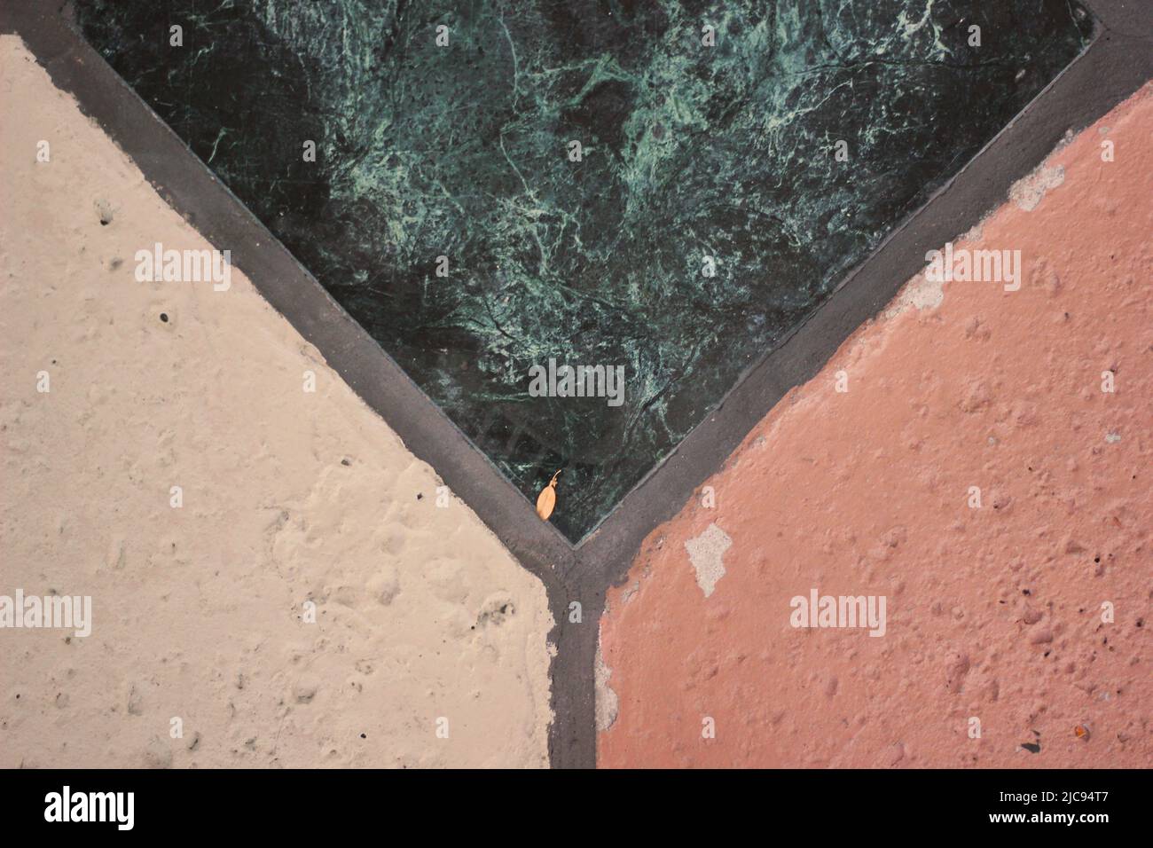 A closeup view of three different floor coverings coming together in a ...