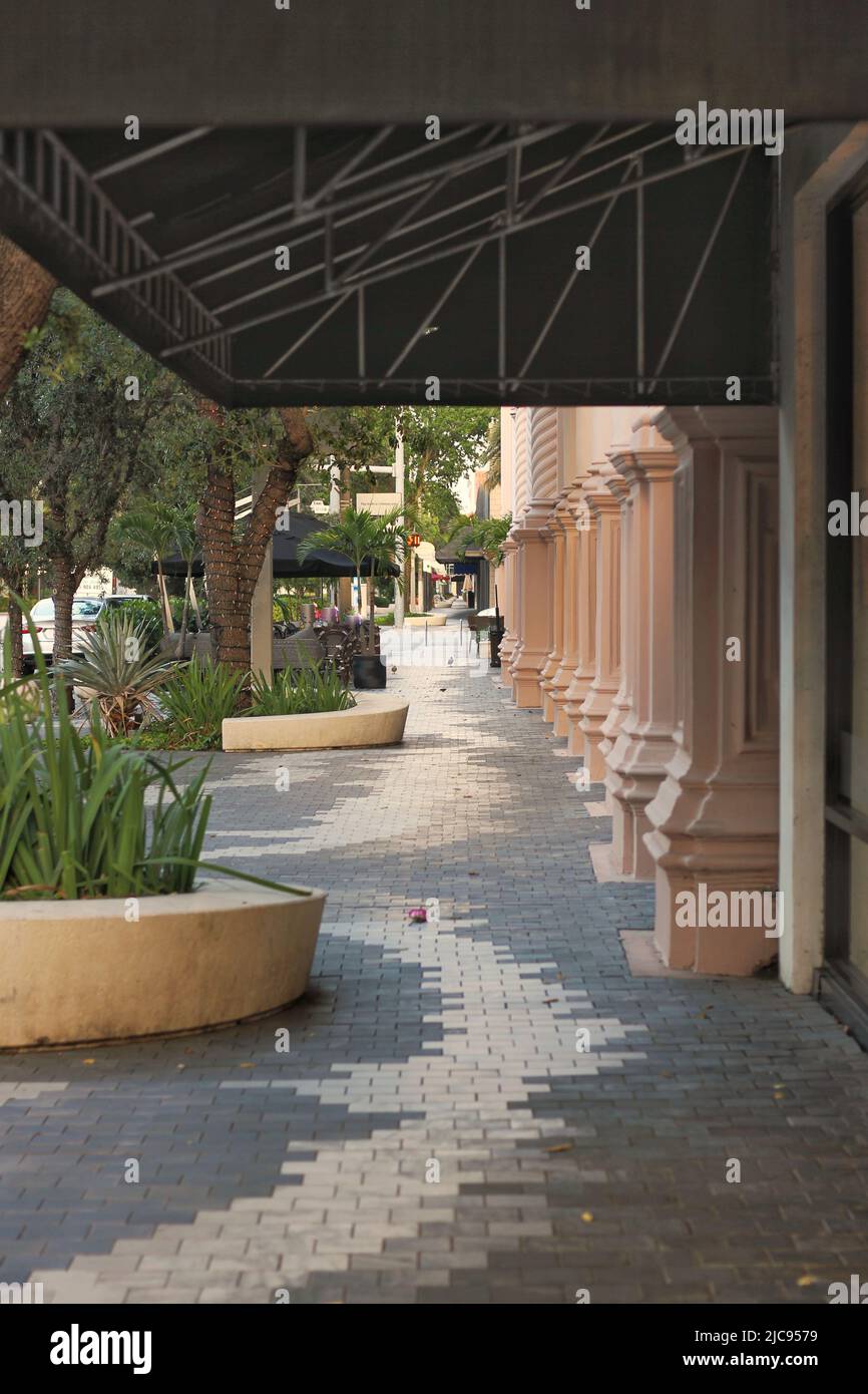 An interesting paved sidewalk winding thru the downtown Stock Photo - Alamy