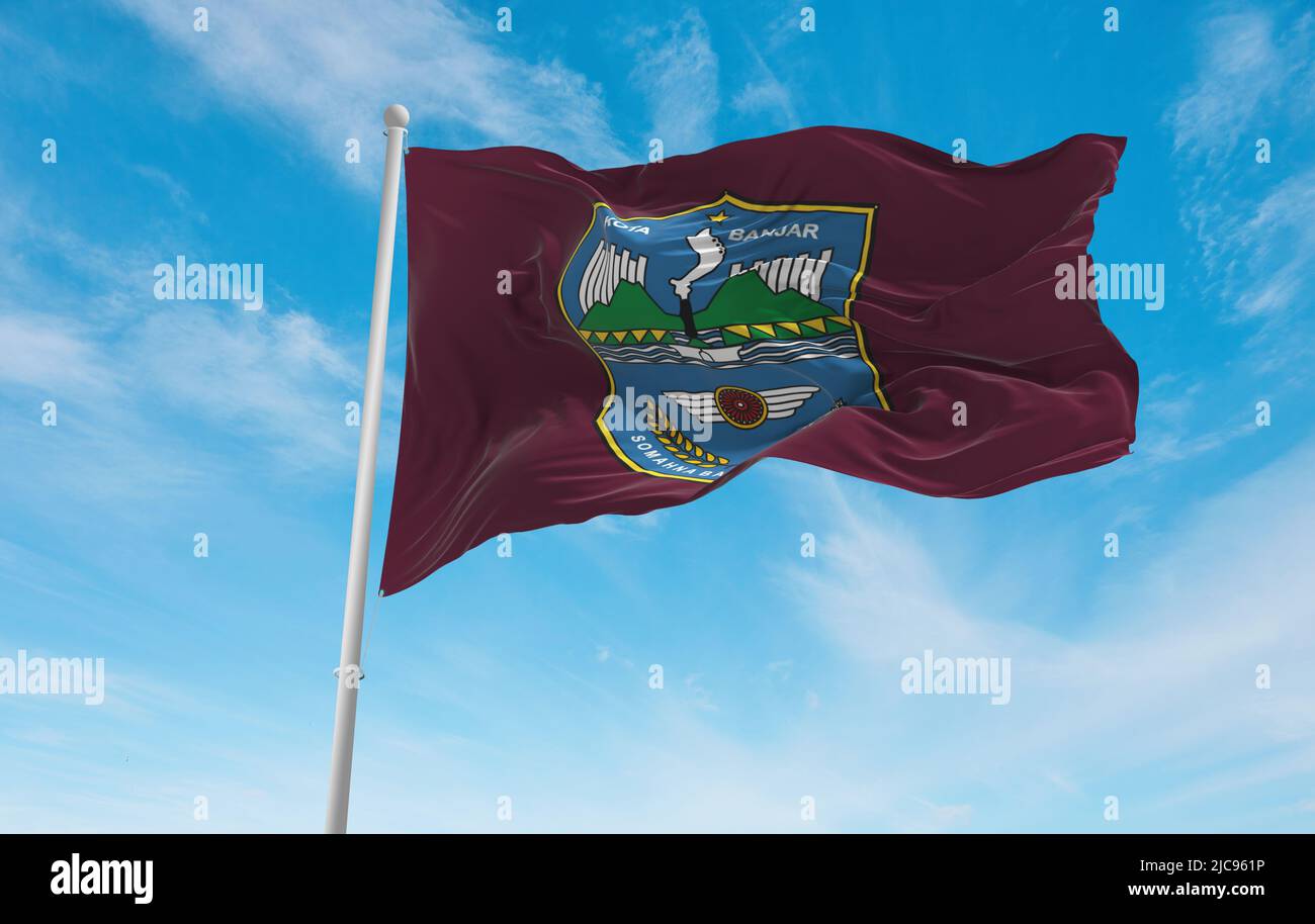 official flag of Banjar City Indonesia at cloudy sky background on ...